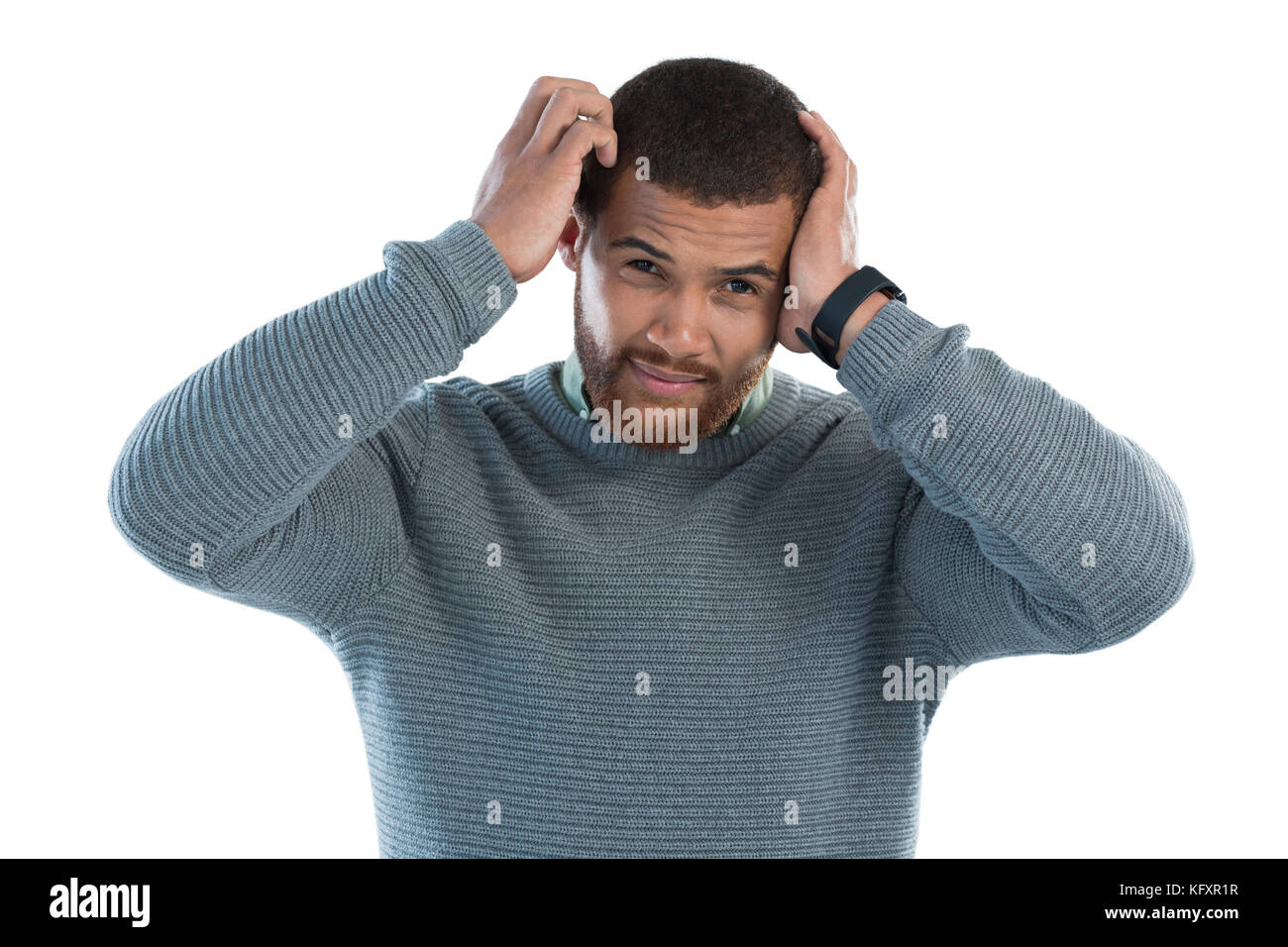 Portrait of confused man against white background Stock Photo - Alamy