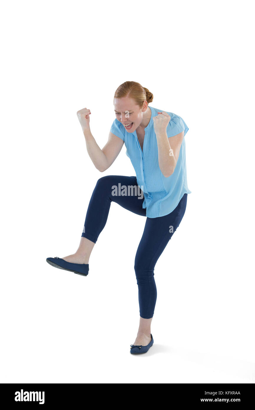 Happy female executive dancing against white background Stock Photo - Alamy