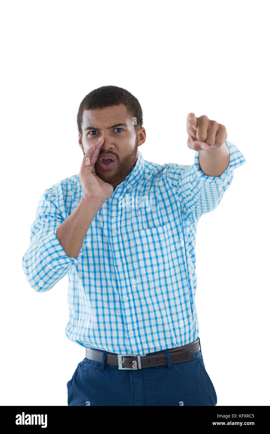Young male executive shouting against white background Stock Photo - Alamy