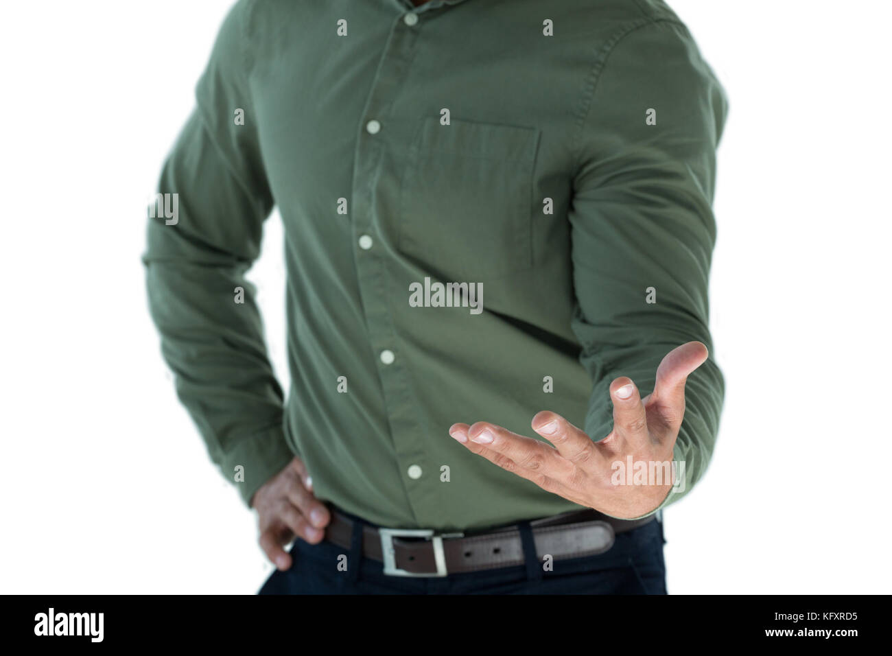 Mid-section of male executive pretending to hold an invisible object ...