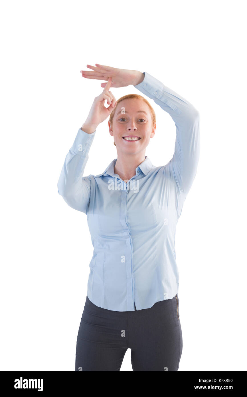 Businesswoman showing time out hand sign against white background Stock ...