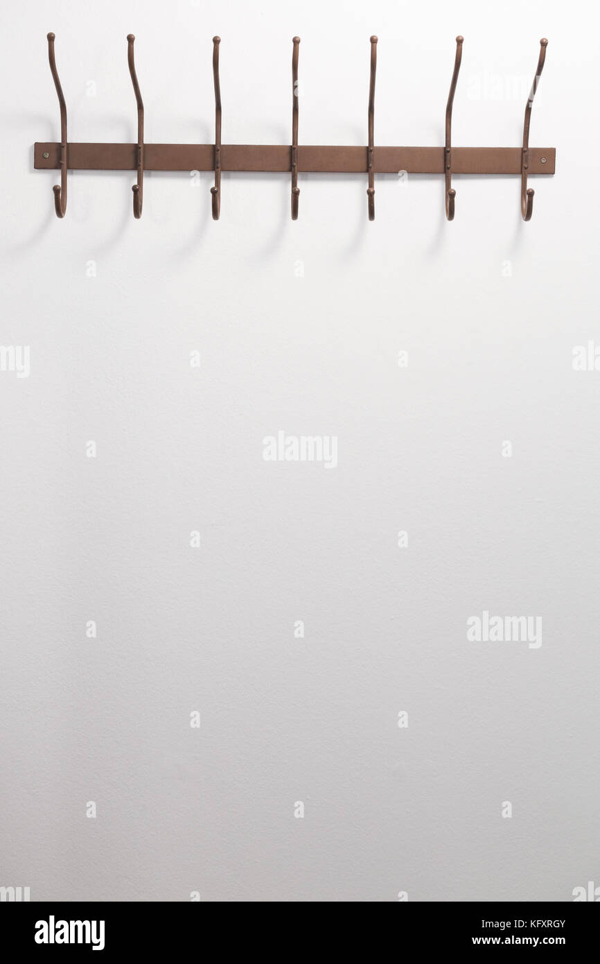 Empty hook attached on wall Stock Photo - Alamy