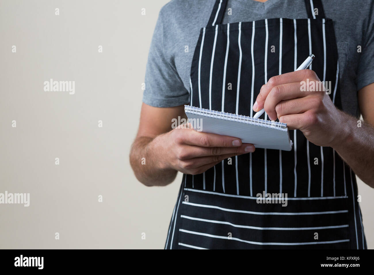 Young caucasian waiter serving order hi-res stock photography and ...