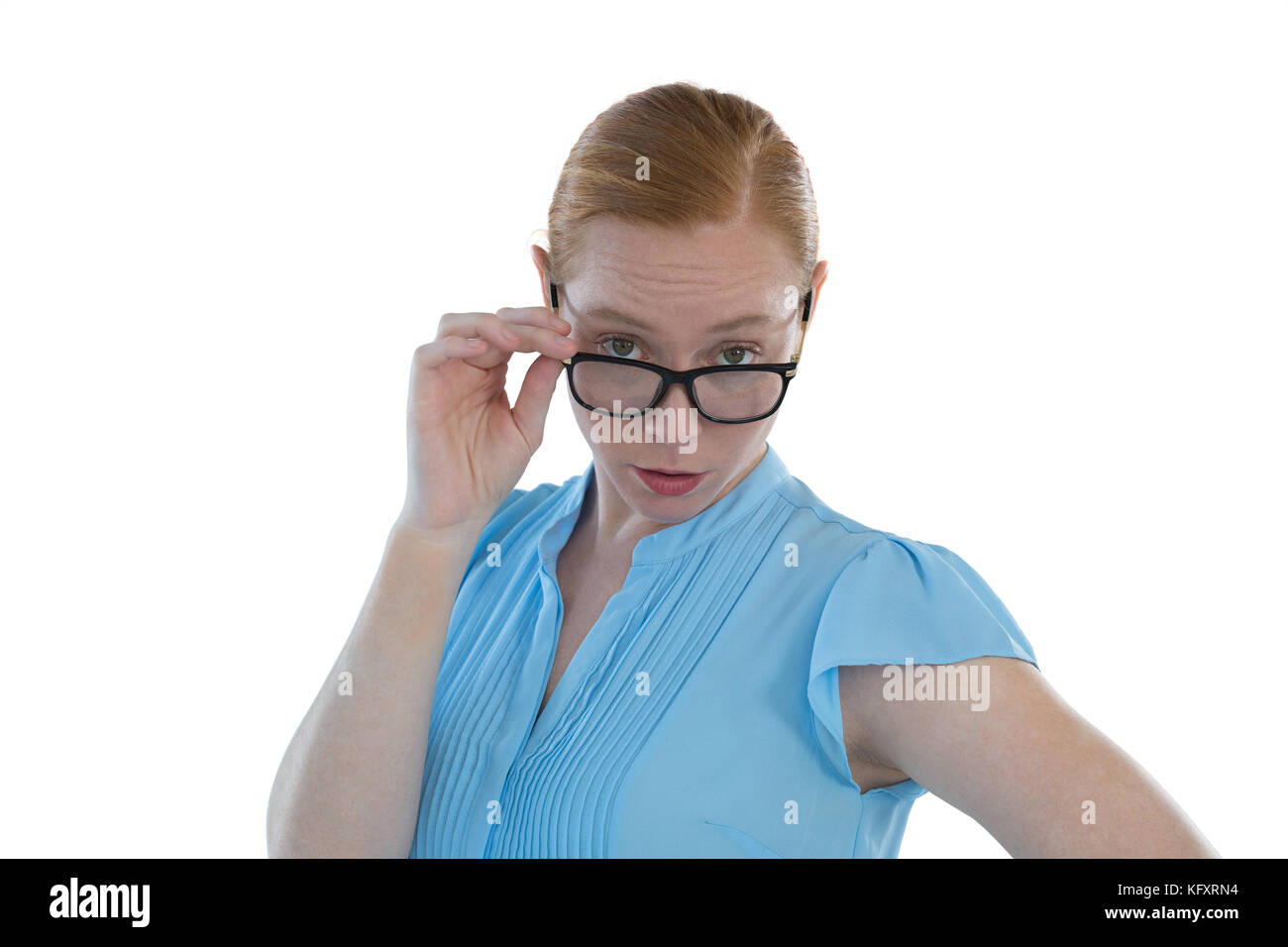 Female executive posing in spectacles against white background Stock ...