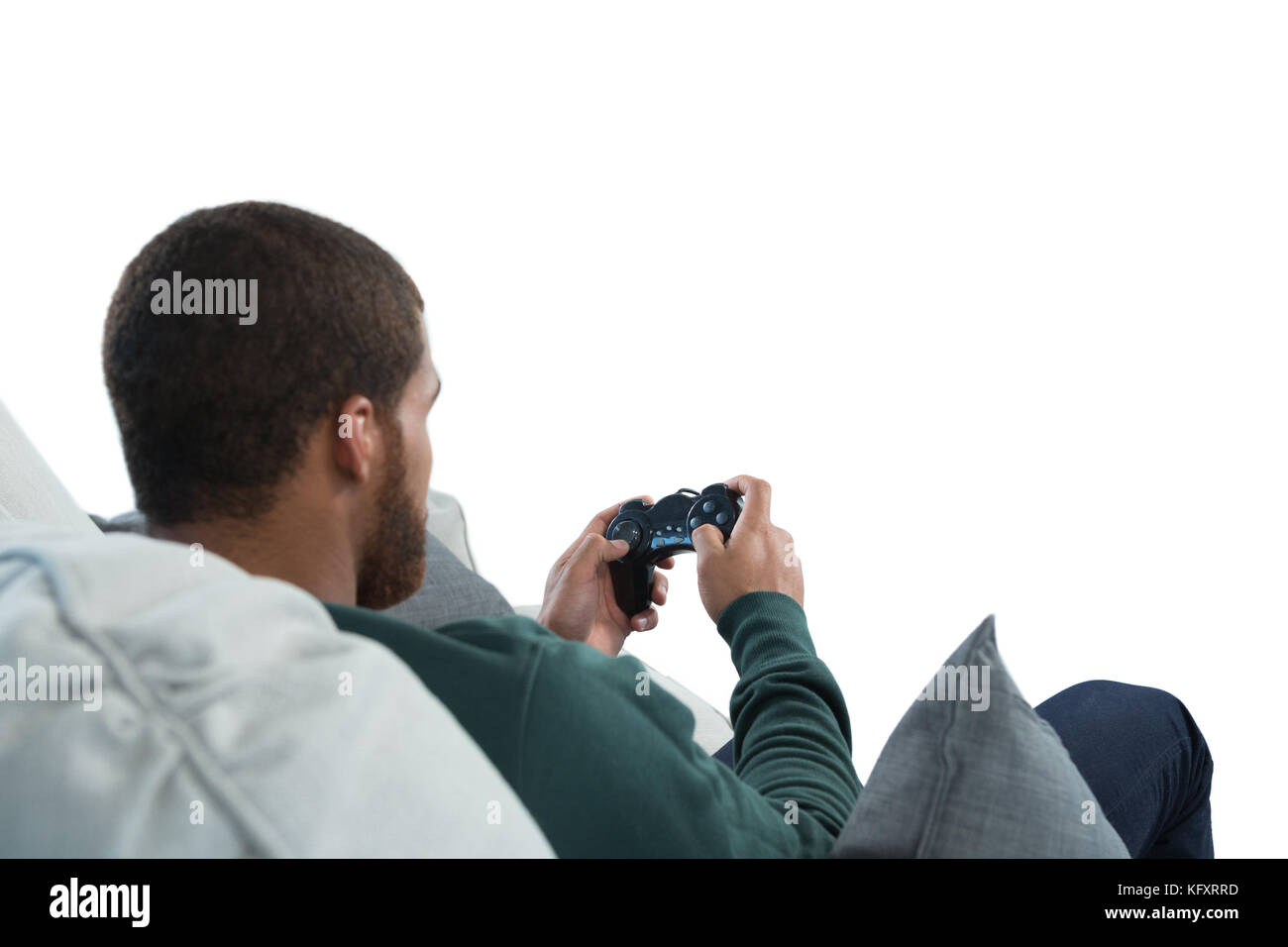 Rear view of man playing video game against white background Stock ...
