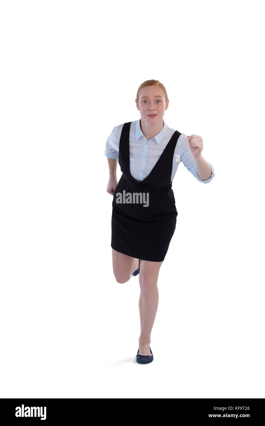 Young female executive running against white background Stock Photo - Alamy