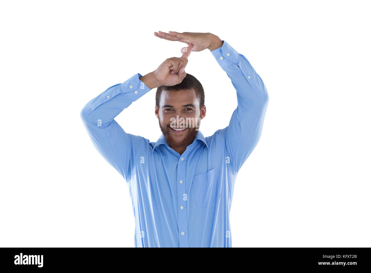 Male executive making hand sign against white background Stock Photo ...