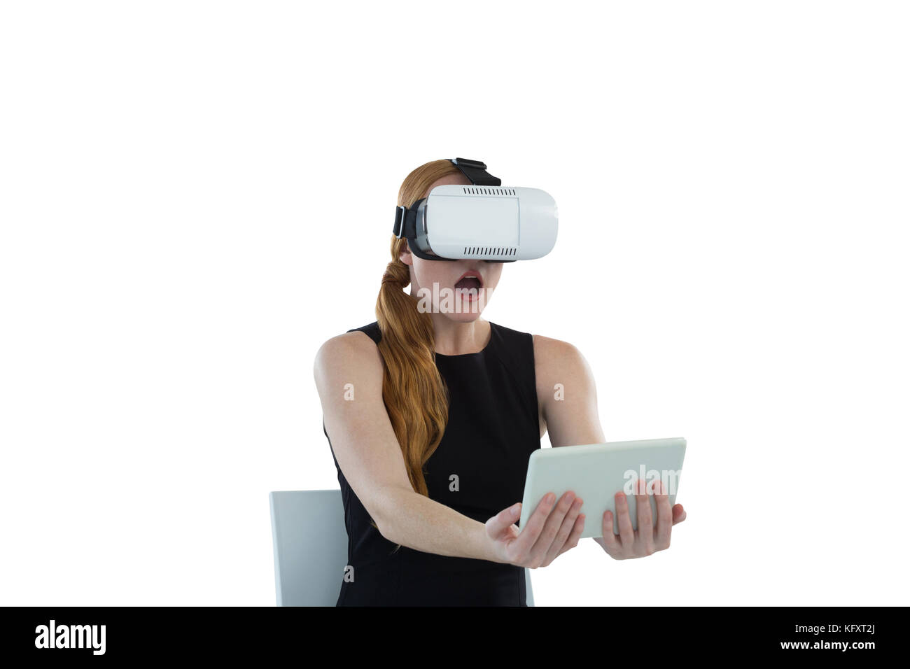 Female executive holding digital tablet while using virtual reality ...