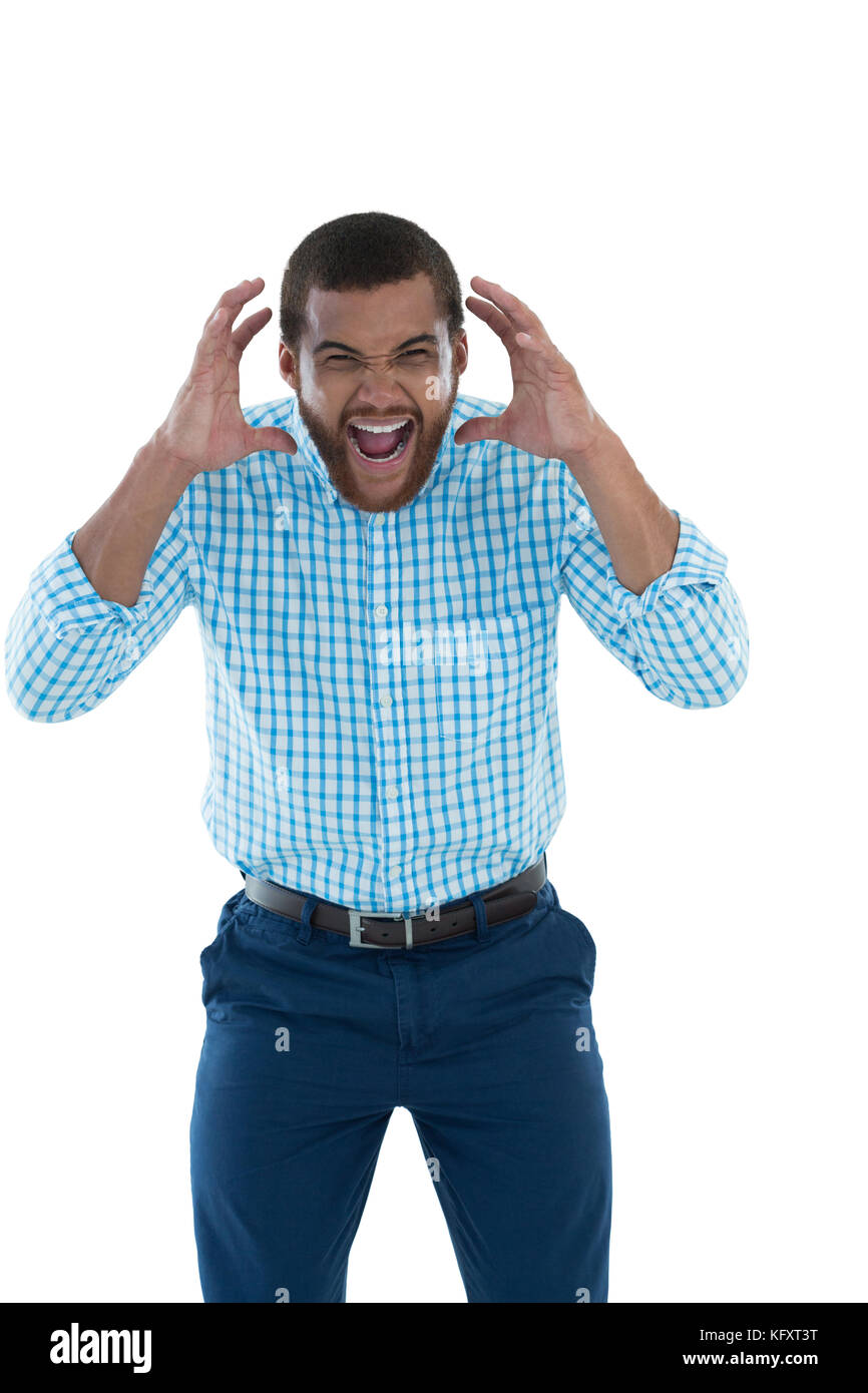 Young male executive shouting against white background Stock Photo - Alamy