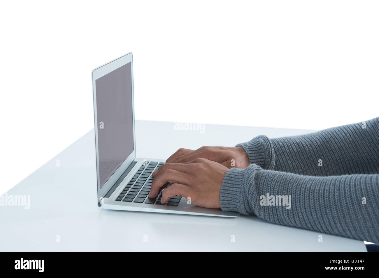 Hands of male executive using laptop at desk Stock Photo - Alamy