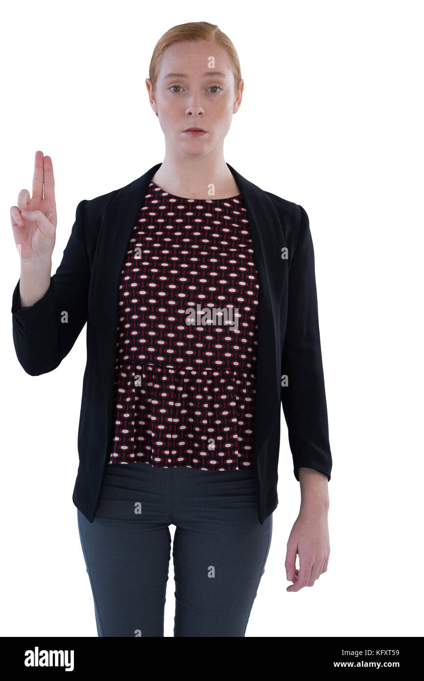 Young female executive gesturing against white background Stock Photo ...
