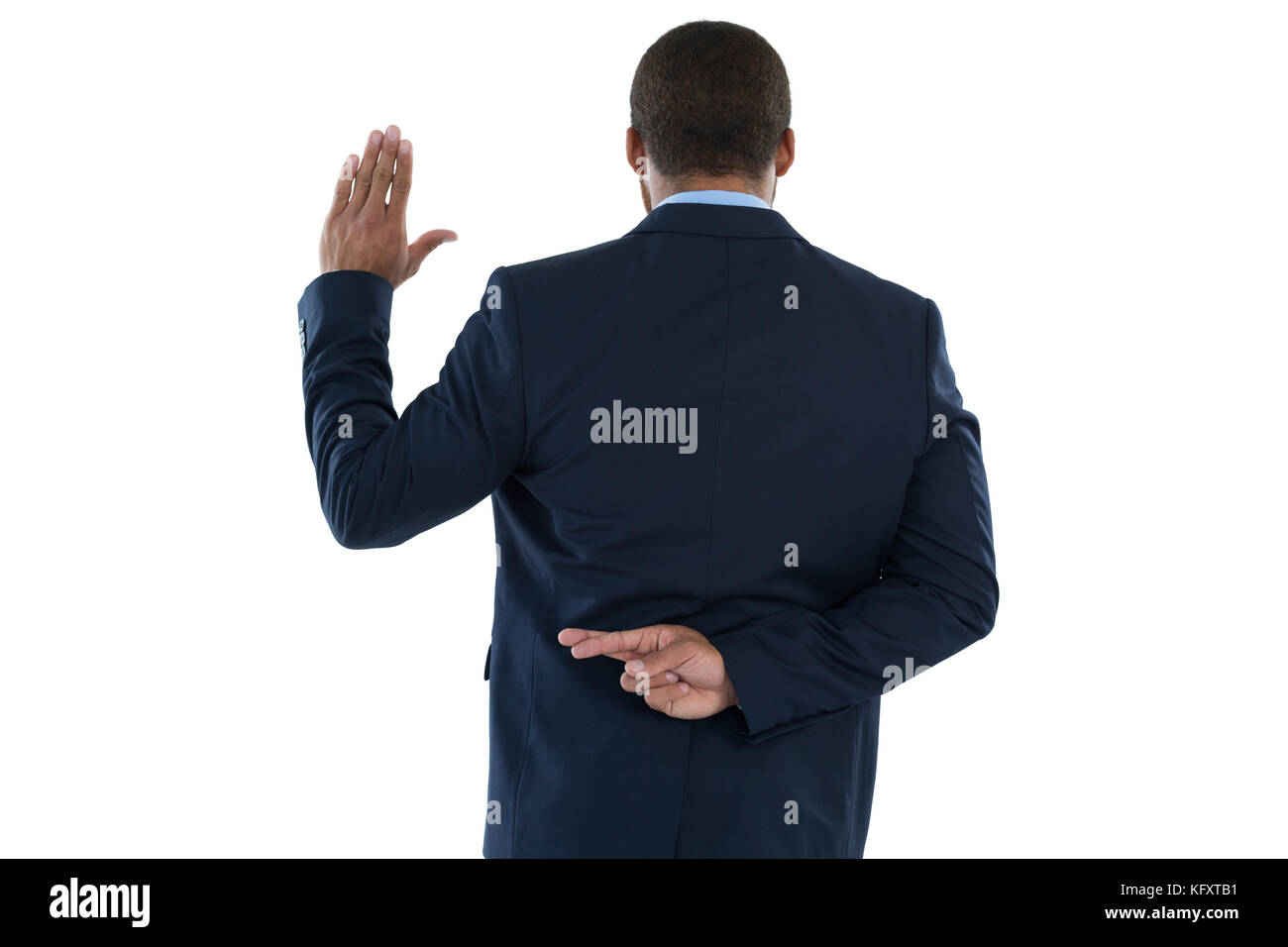 Rear view of businessman gesturing against white background Stock Photo ...
