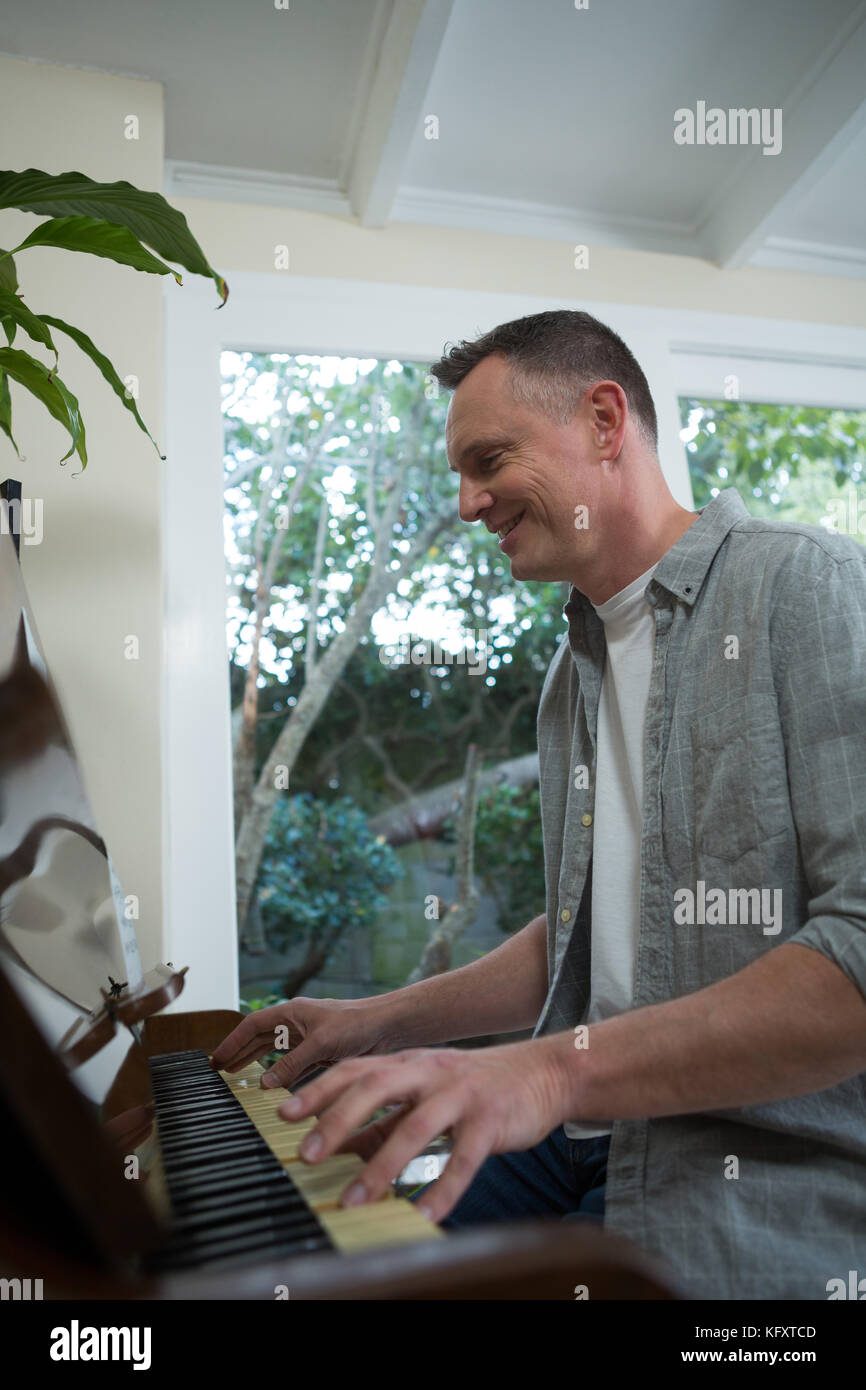 Mature man playing keyboard hi-res stock photography and images - Alamy