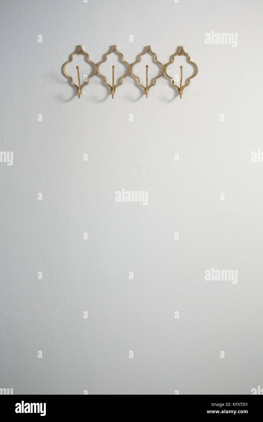 Empty hook attached on wall Stock Photo - Alamy