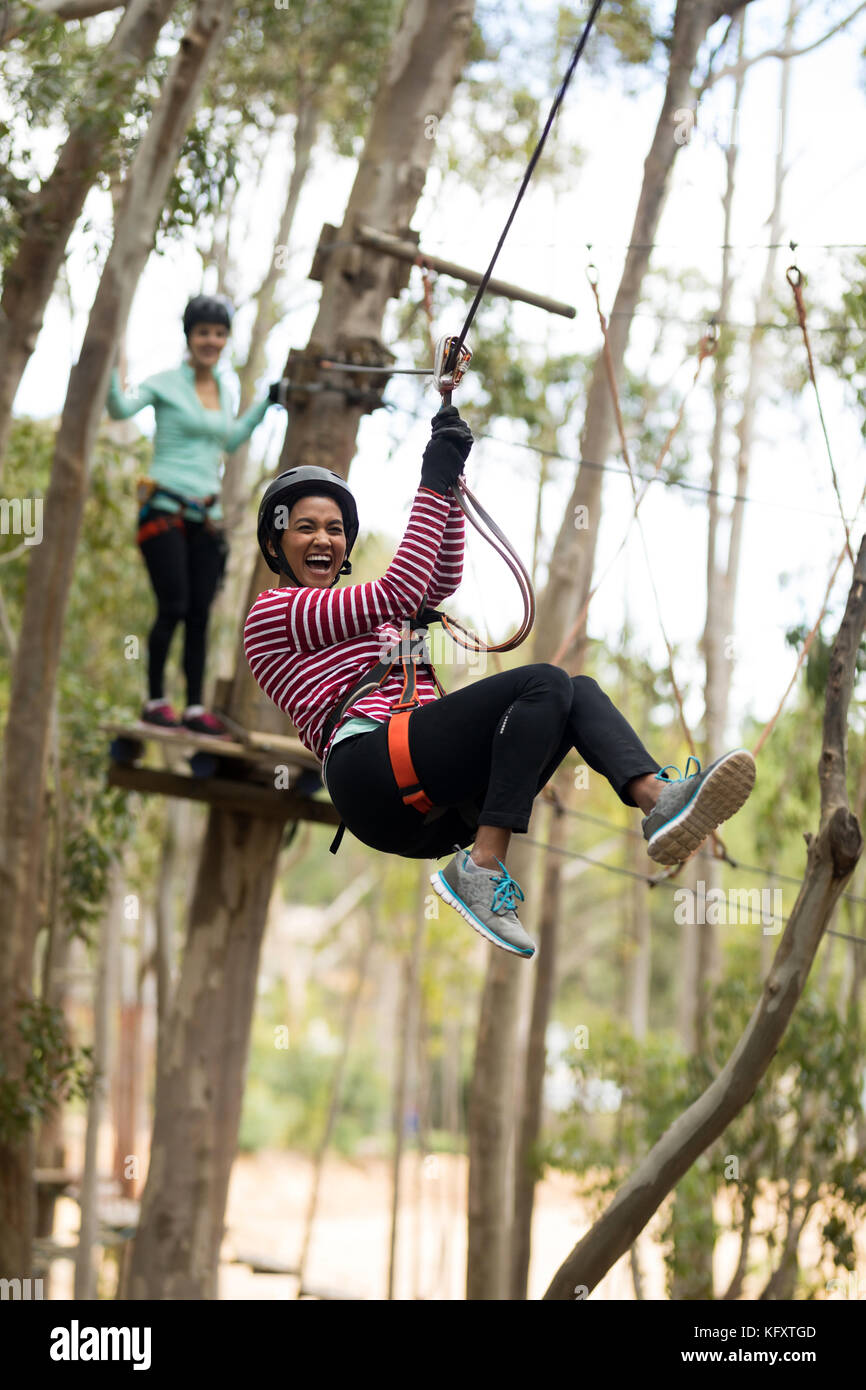 Woman on zipline hi-res stock photography and images - Alamy