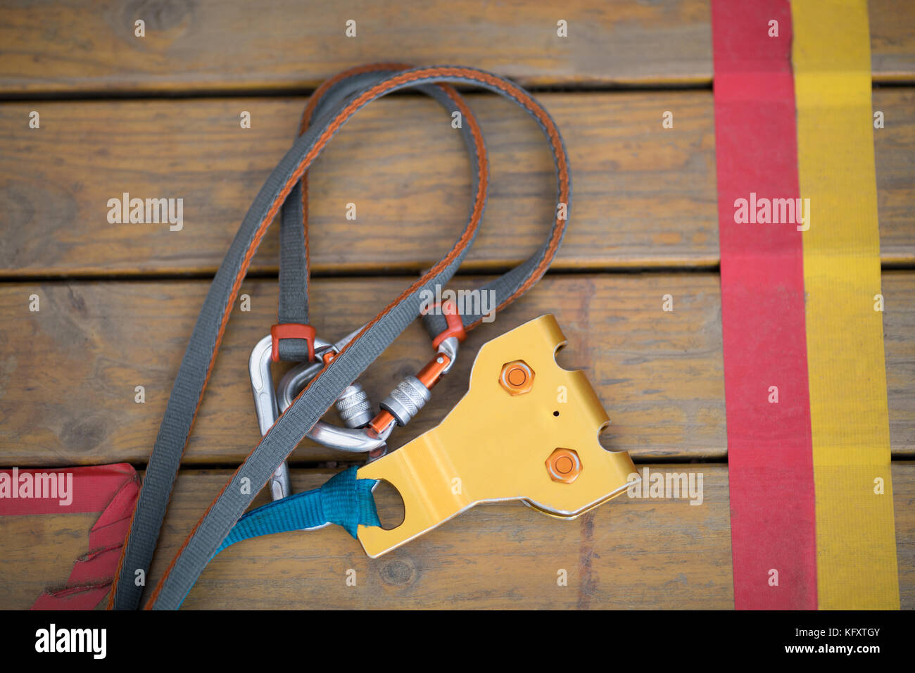 Close-up of carabiner with wire rope on wooden Stock Photo - Alamy