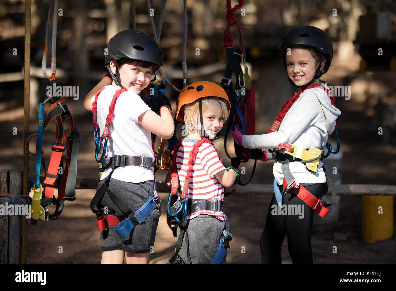 Portrait of happy kids standing together in park on a sunny day Stock ...