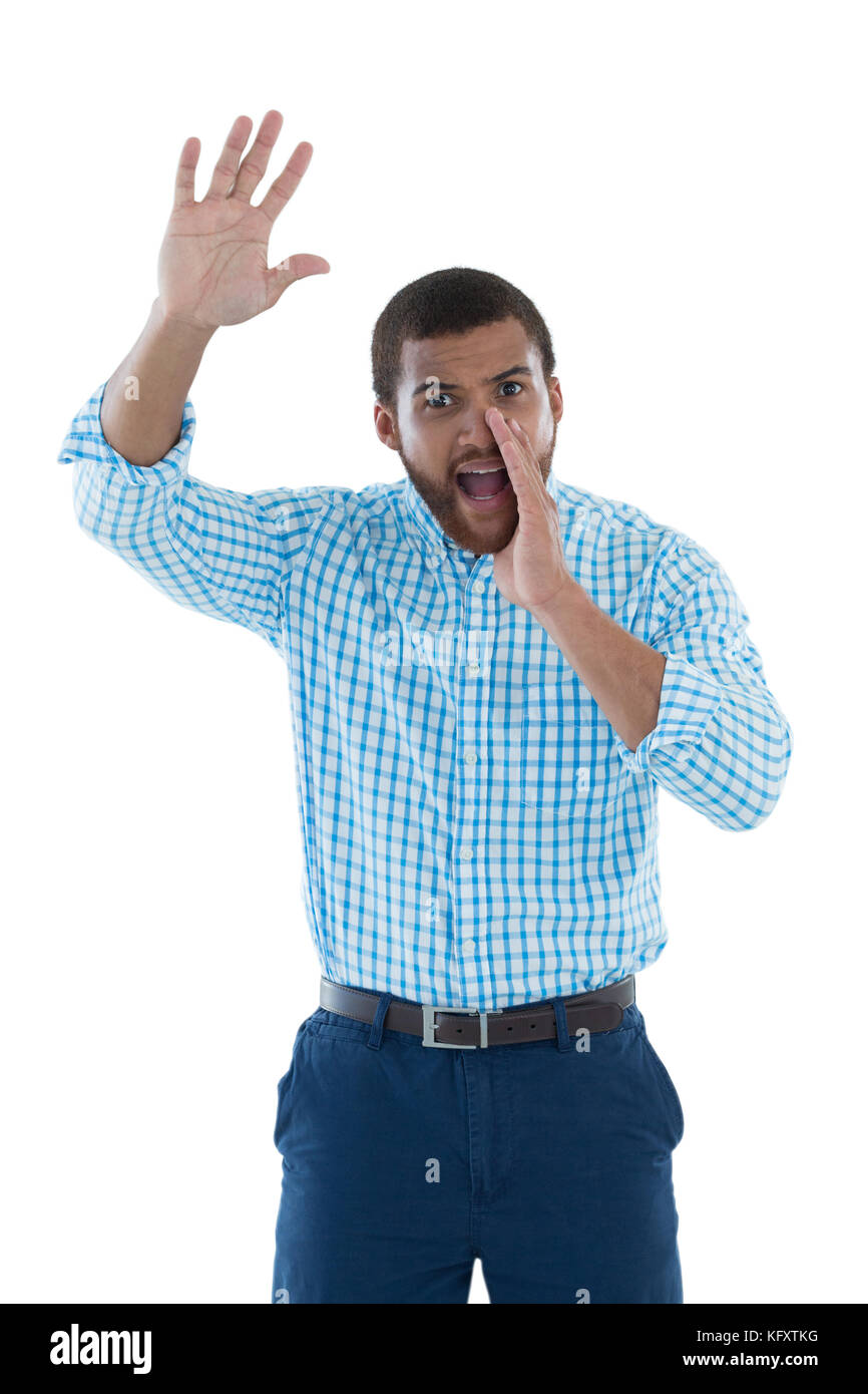 Young male executive shouting against white background Stock Photo - Alamy