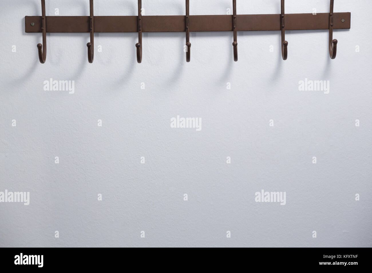 Close-up of empty hook attached on wall Stock Photo - Alamy