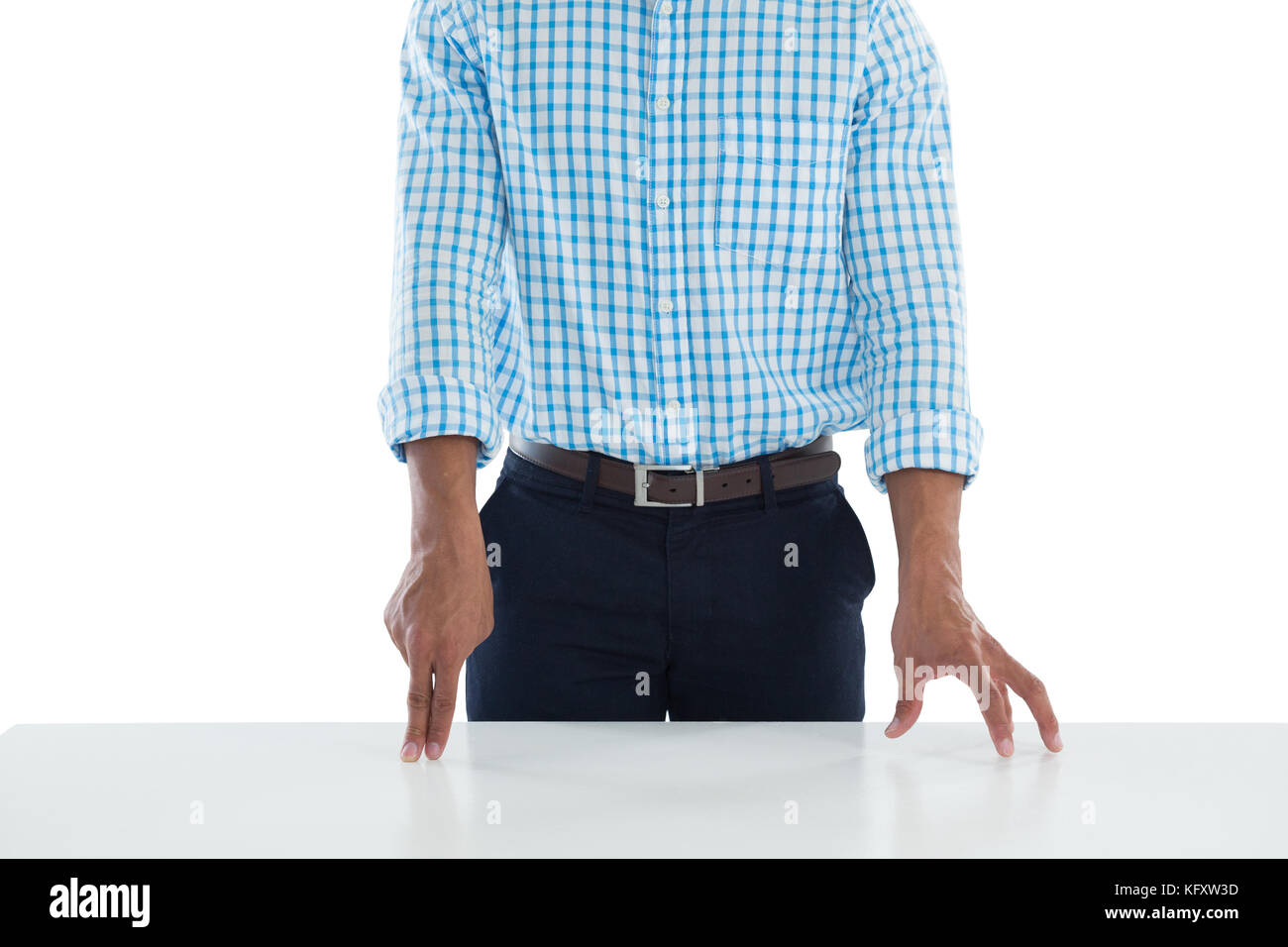 Mid-section of male executive touching invisible screen on desk Stock ...