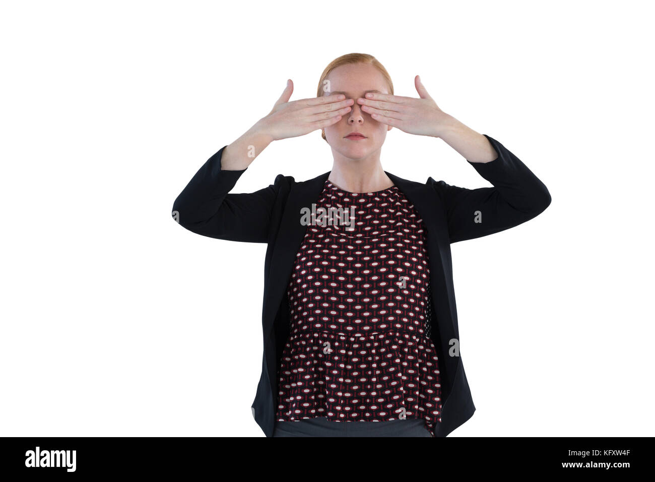 Woman covering both her eyes against white background Stock Photo - Alamy