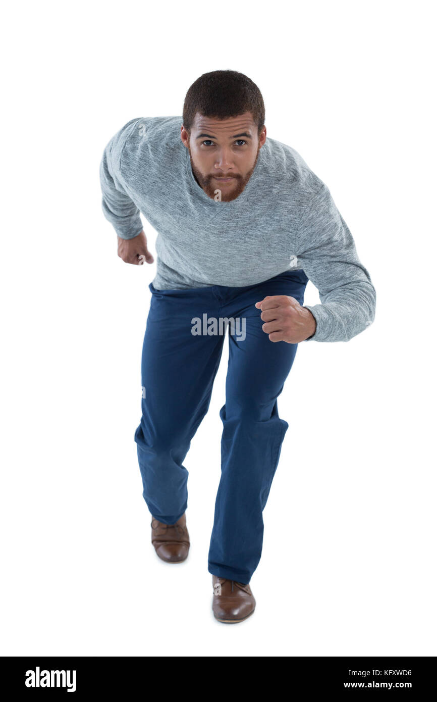 Young male executive running against white background Stock Photo - Alamy