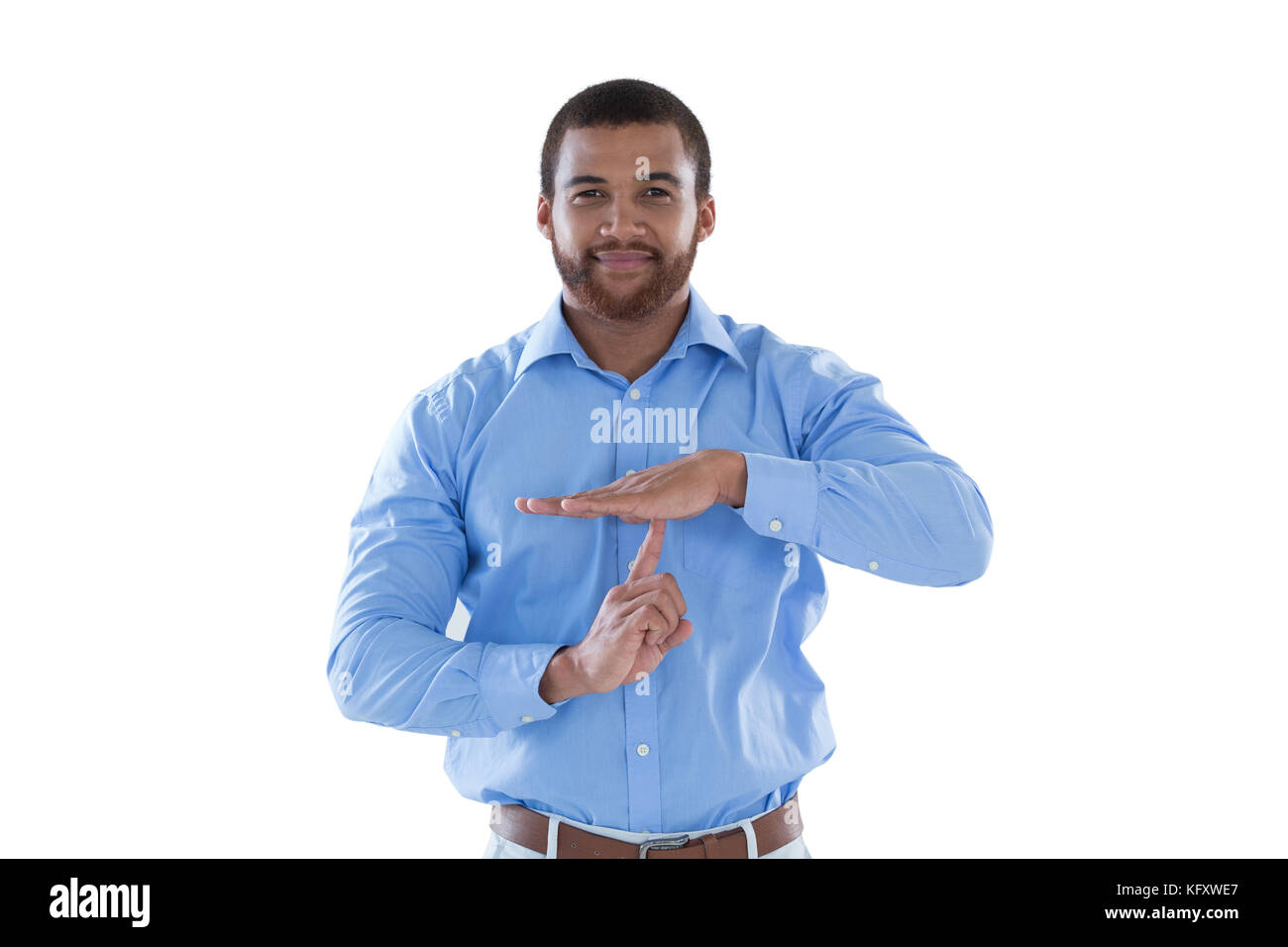 Male executive making hand sign against white background Stock Photo ...