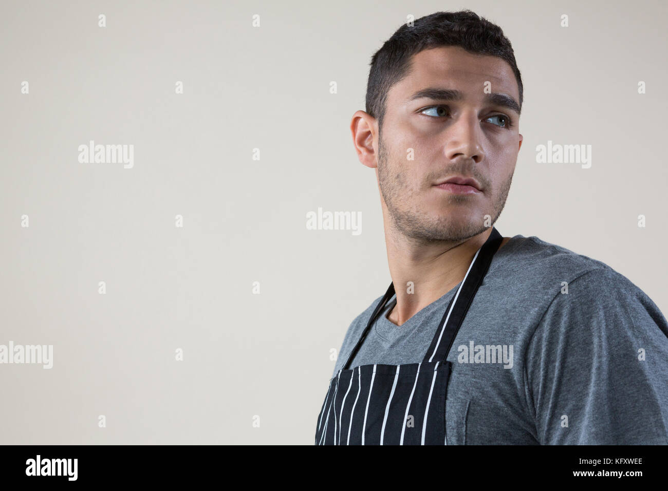 Close-up of waiter looking over his shoulders Stock Photo - Alamy