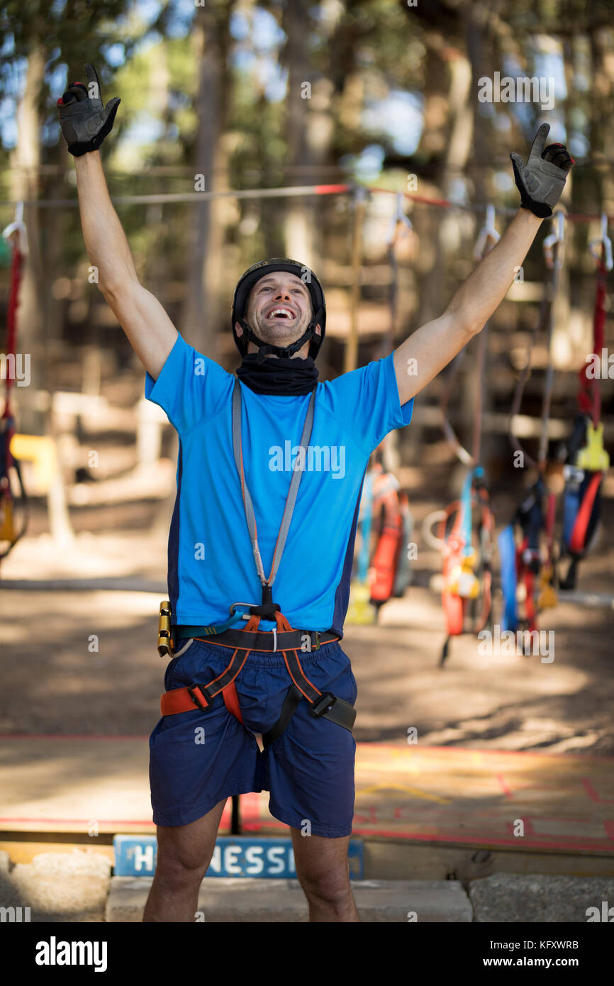 Man standing with arms up hi-res stock photography and images - Alamy