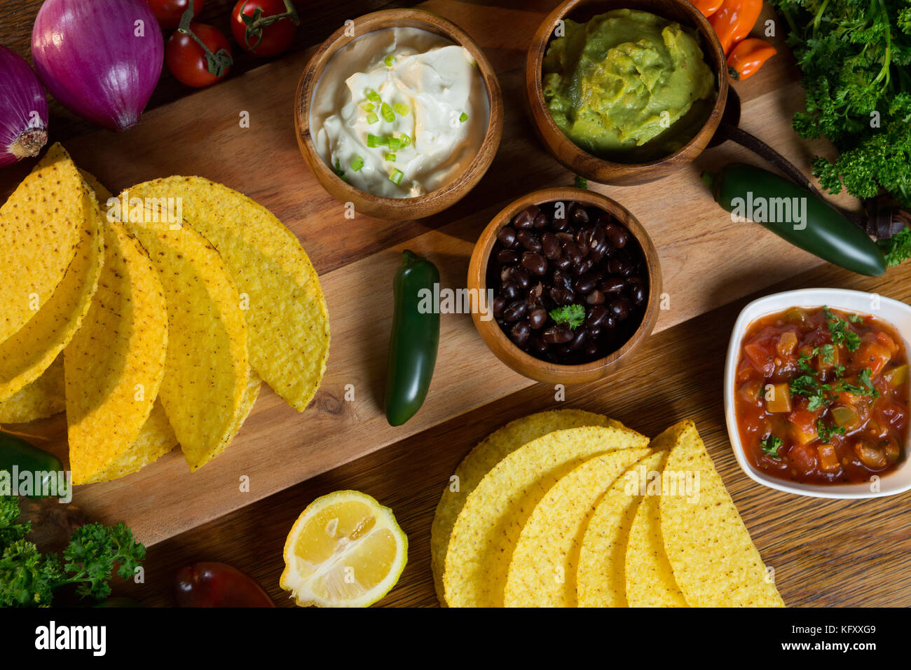 Various mexican food ingredients on wooden table Stock Photo - Alamy