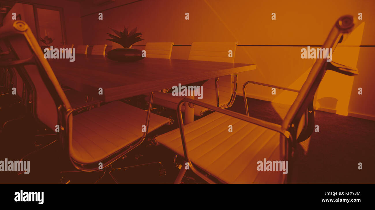 Empty chairs by conference table at modern office Stock Photo - Alamy