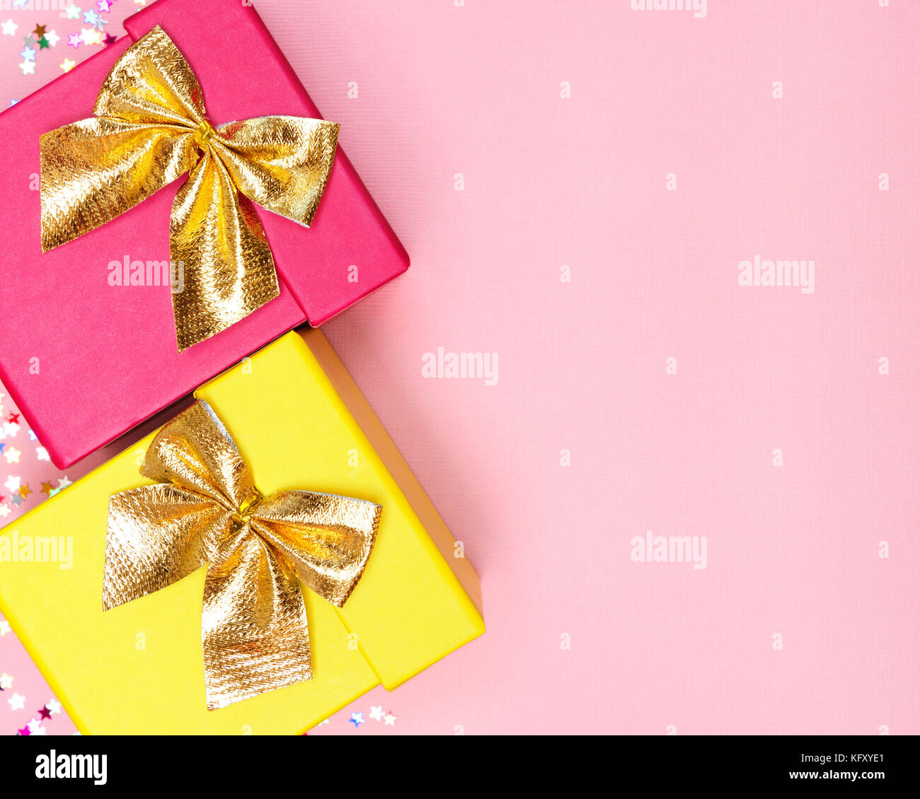 Close-up of two color gift boxes with golden bows. Copy space Stock ...