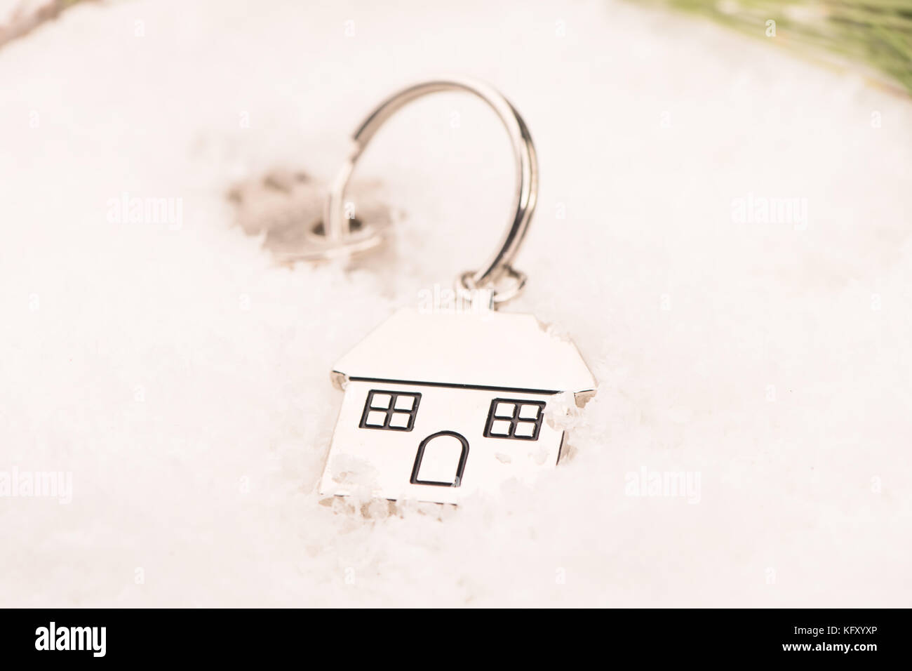 House key in the snow Stock Photo - Alamy