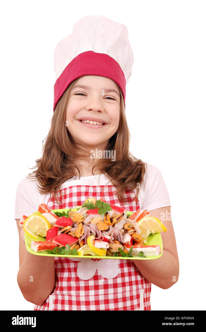 happy little girl cook with seafood Stock Photo - Alamy