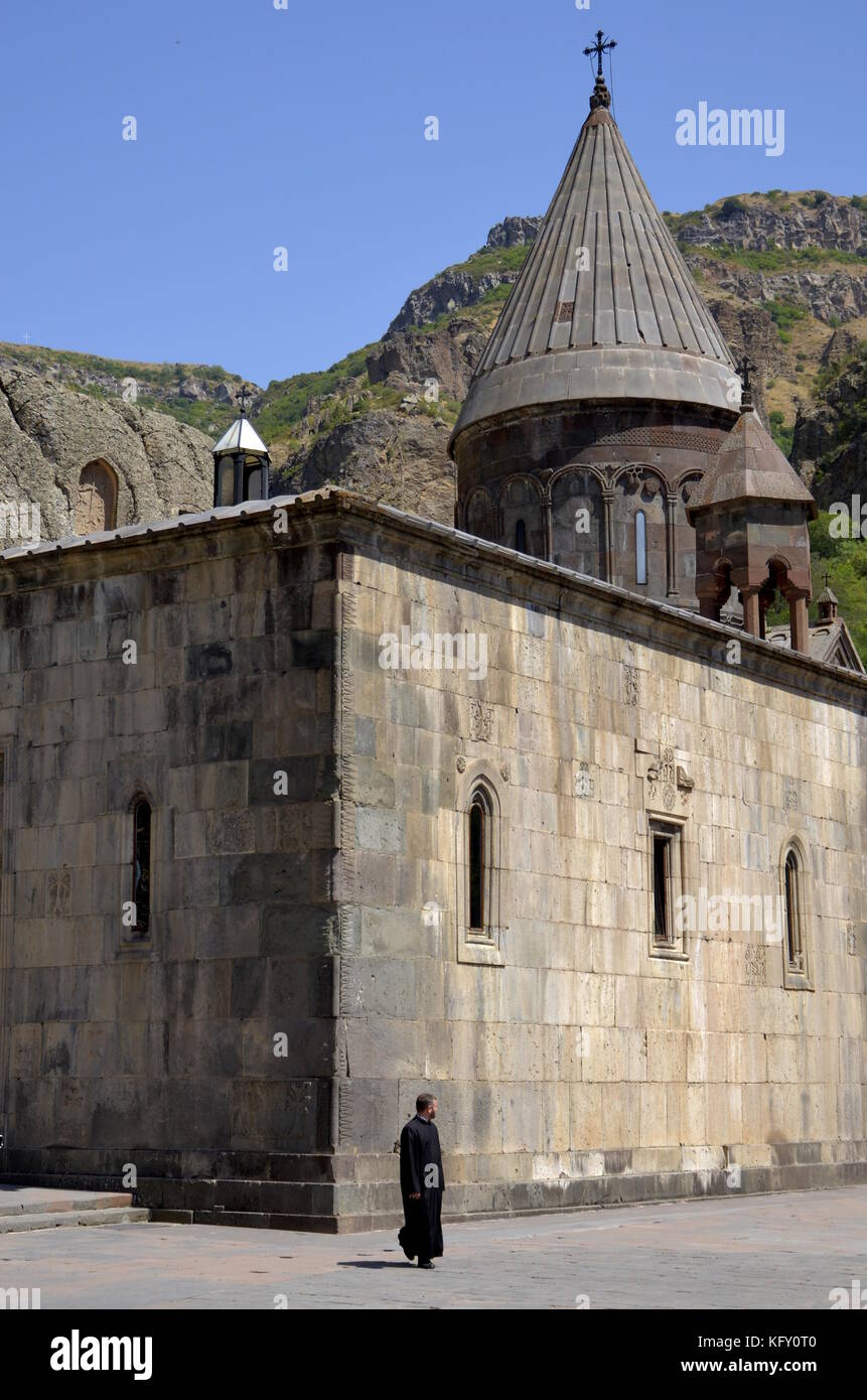 A priest outside Geghard Monastery, UNESCO World Heritage site near ...