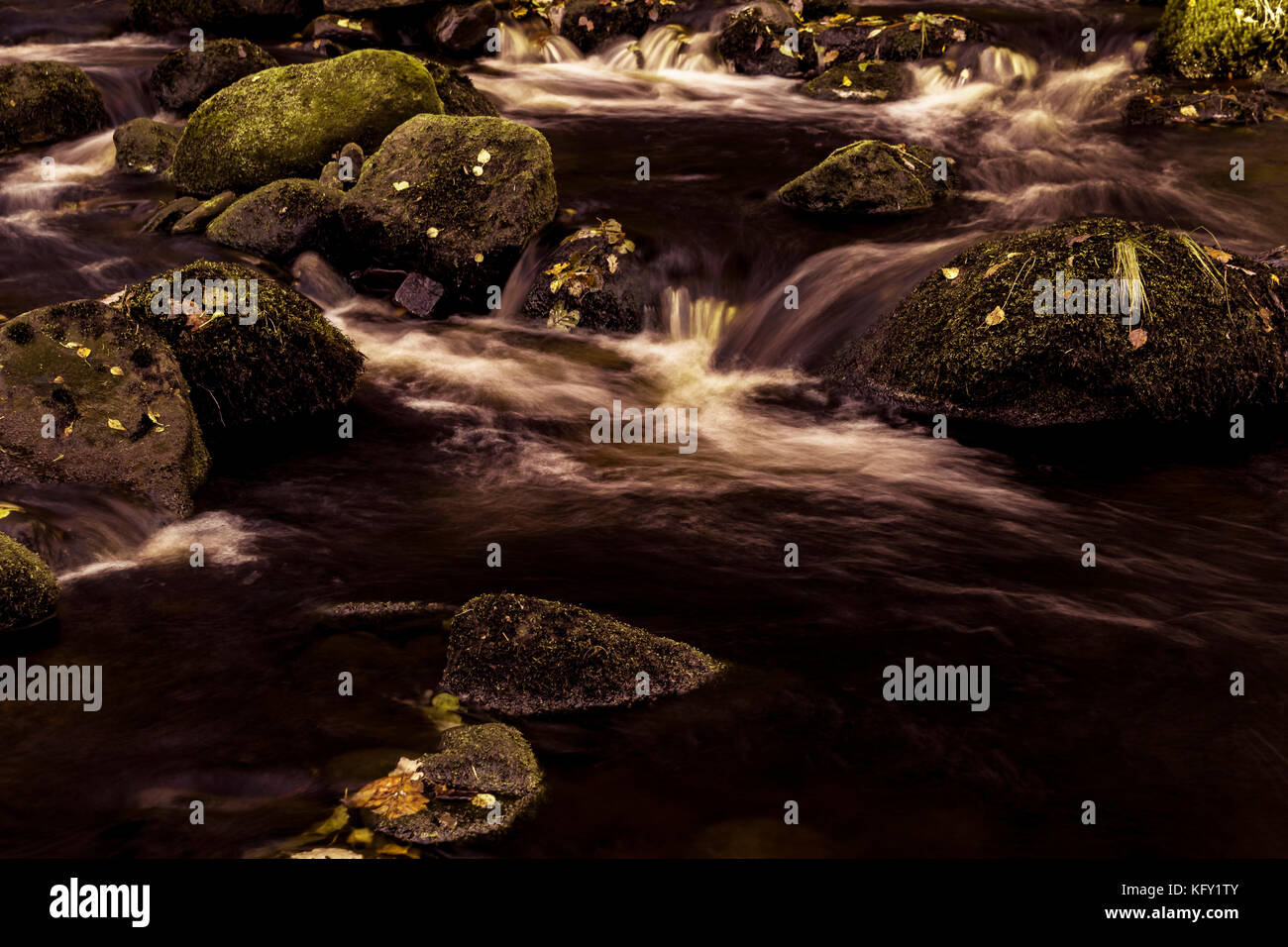 stream running through countryside Stock Photo - Alamy