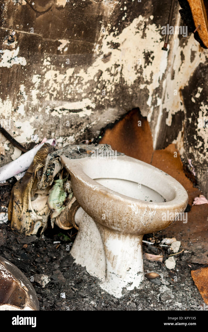 Melted toilet and sink in burned house in abandoned hospital Stock ...
