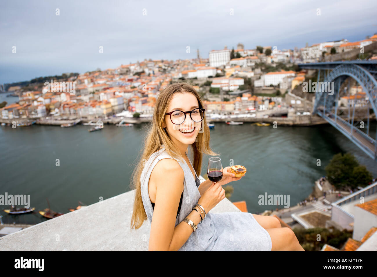 Woman with portuguese dessert in Porto Stock Photo - Alamy