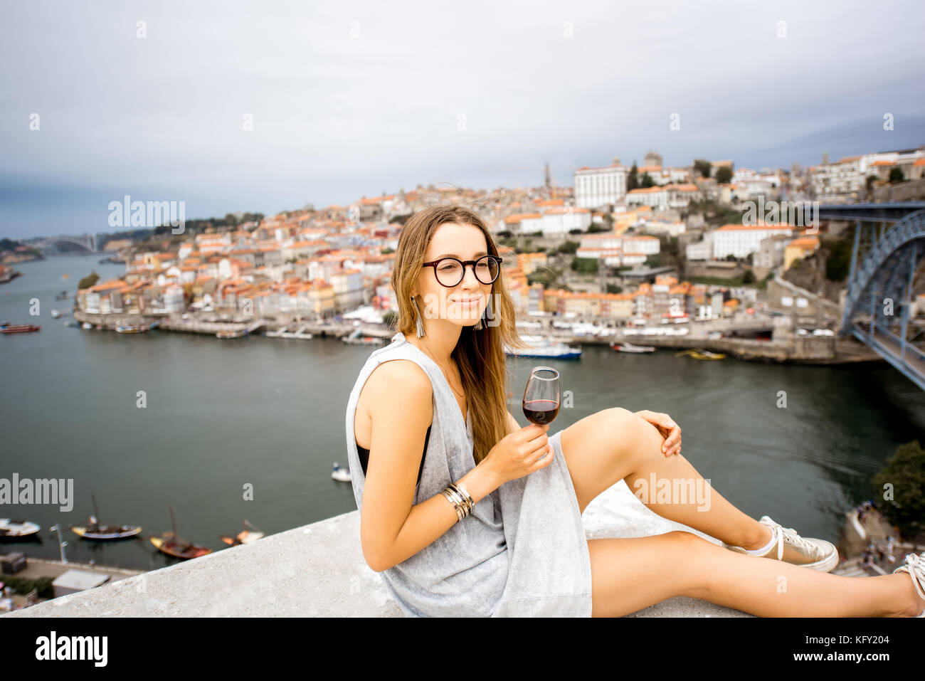 Woman with Porto wine in Portuguese Stock Photo - Alamy