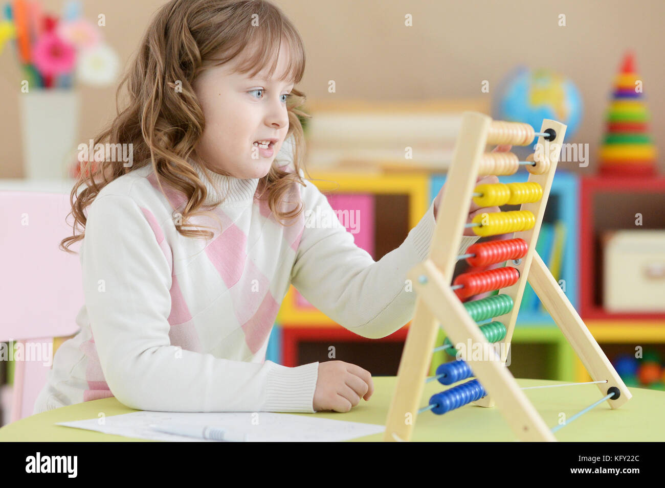 Child with abacus hi-res stock photography and images - Alamy