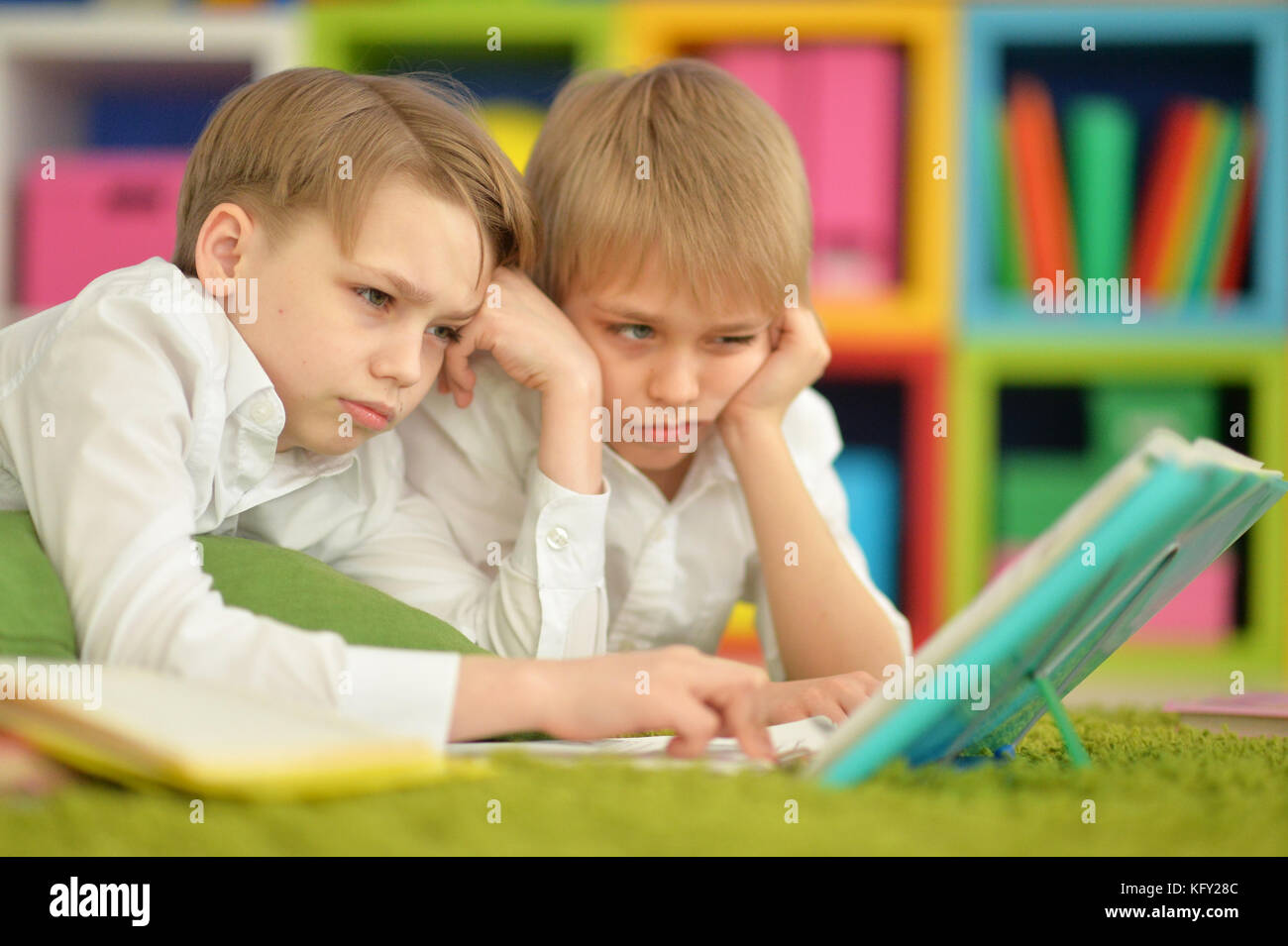 Two boys reading book hi-res stock photography and images - Alamy