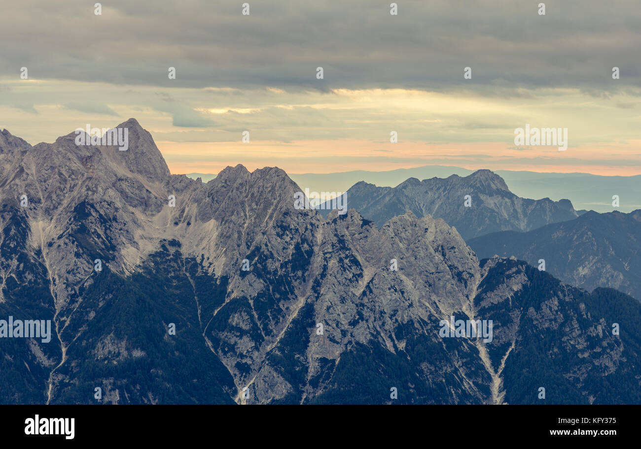 Sunrise behind a mountain ridge Stock Photo - Alamy