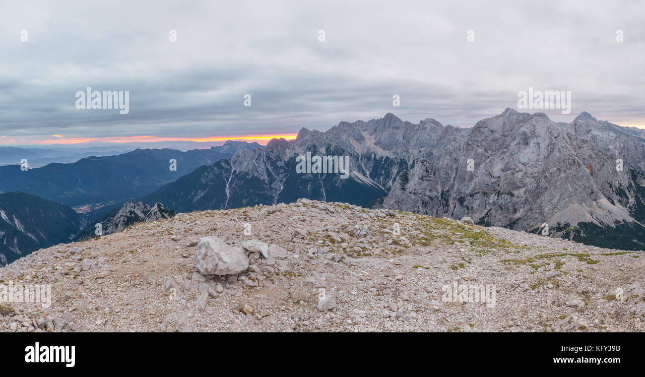 Panorama of sun rising behind mountain ridge Stock Photo - Alamy