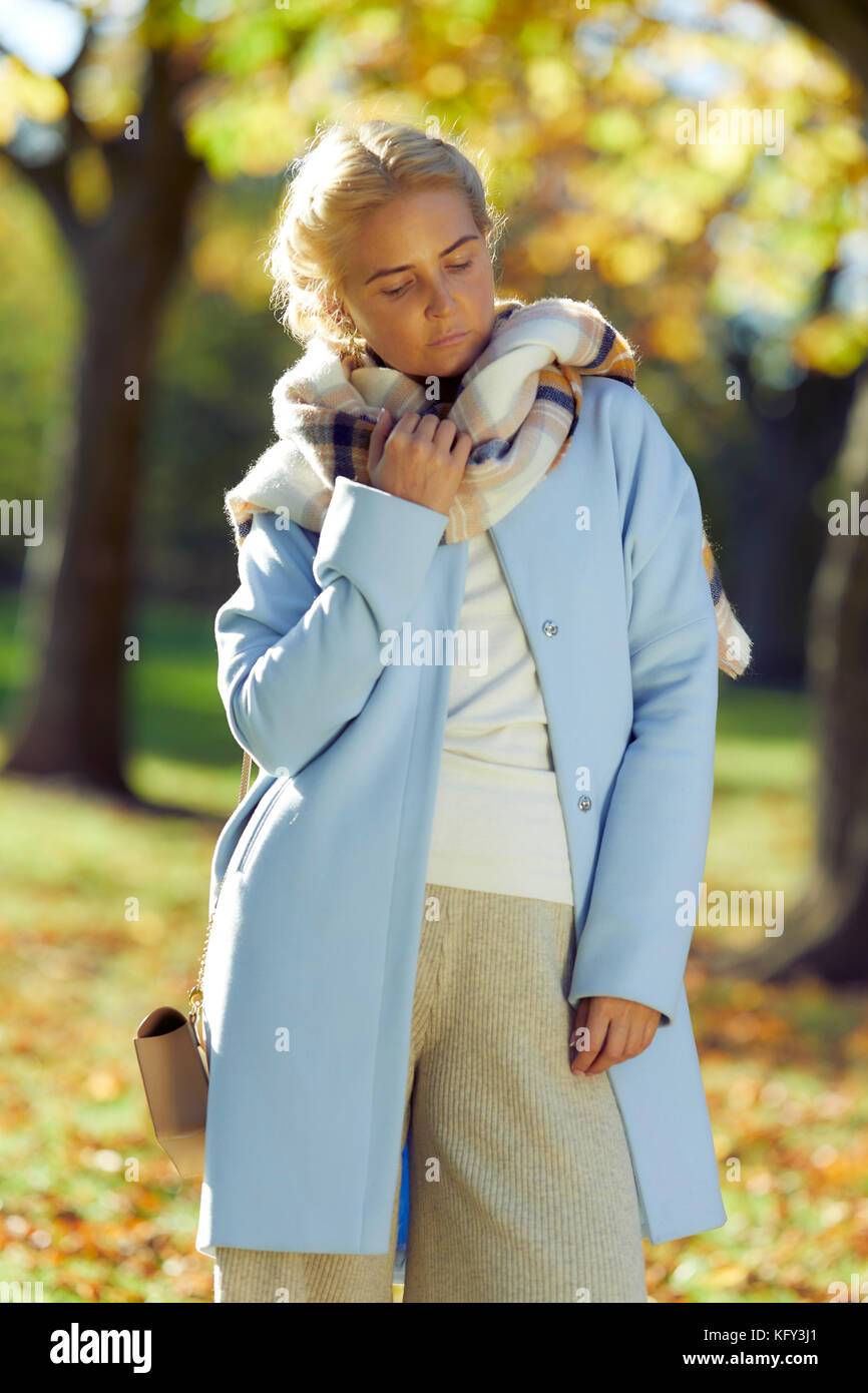 Woman looking concerned outdoors Stock Photo - Alamy
