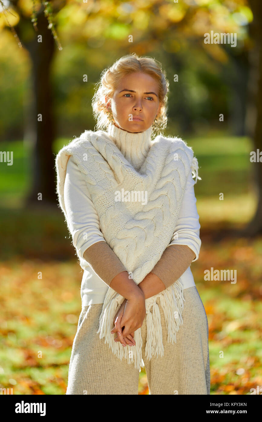Woman looking concerned outdoors Stock Photo - Alamy