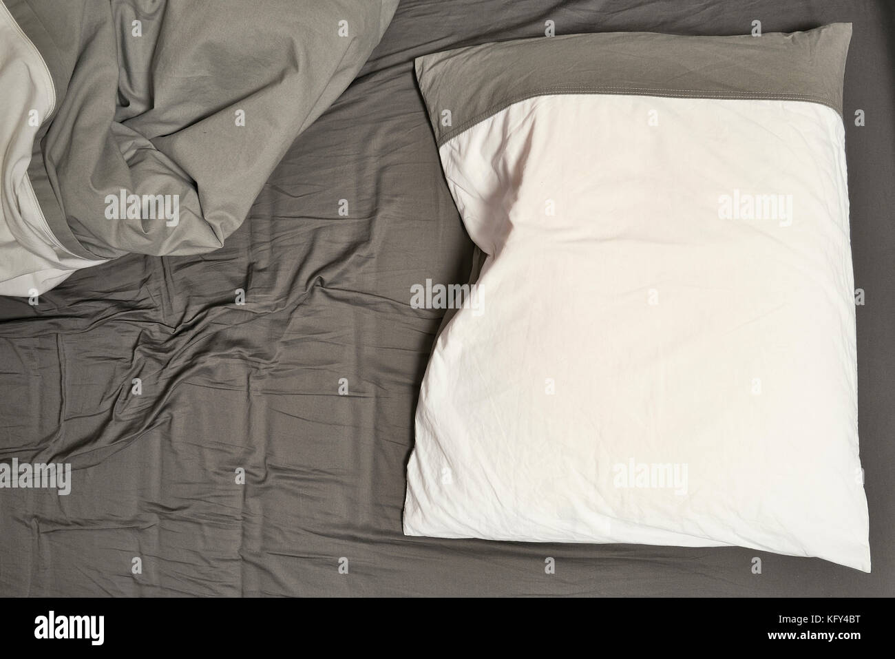 Disheveled sheets and pillows of an unmade bed Stock Photo - Alamy
