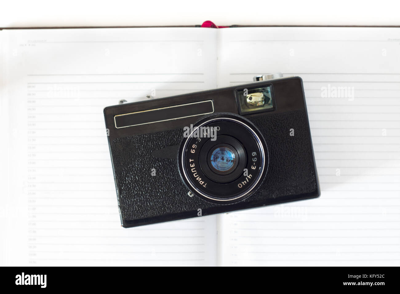 retro still camera and some old photos on white background Stock Photo ...