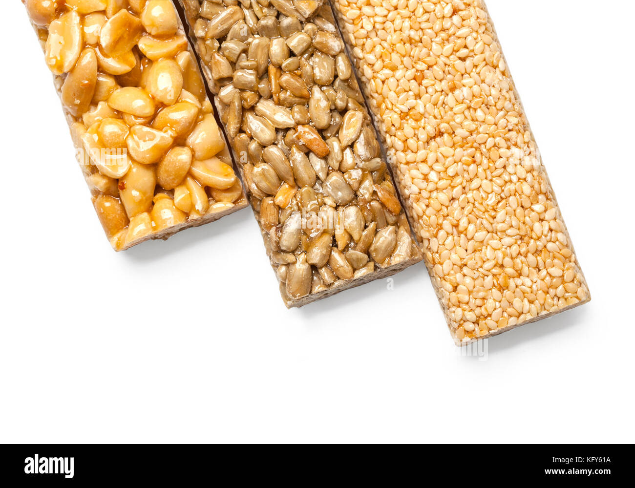 sunflower seeds, sesame ,peanuts in sugar syrup isolated on a white ...