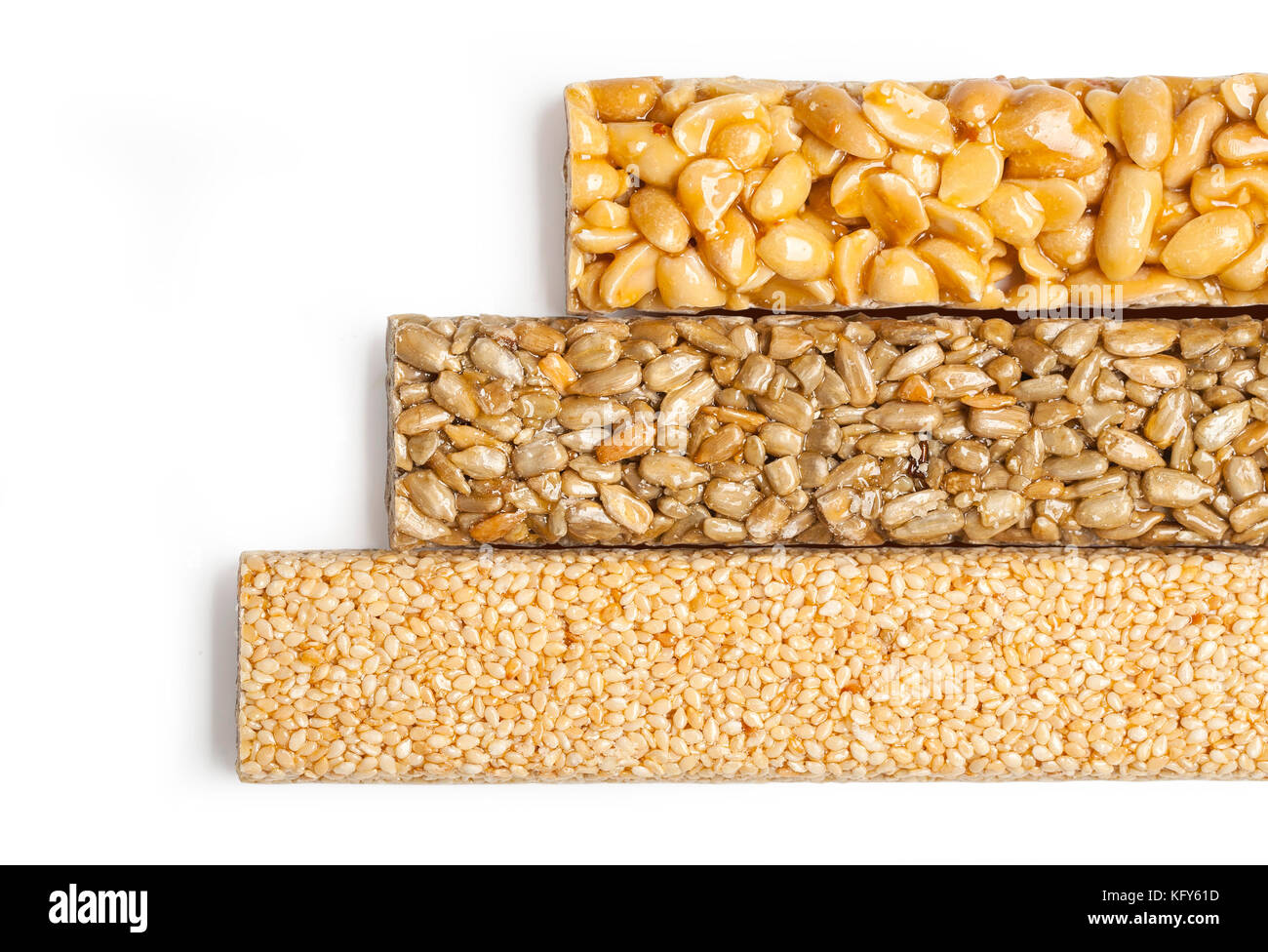 sunflower seeds, sesame ,peanuts in sugar syrup isolated on a white ...