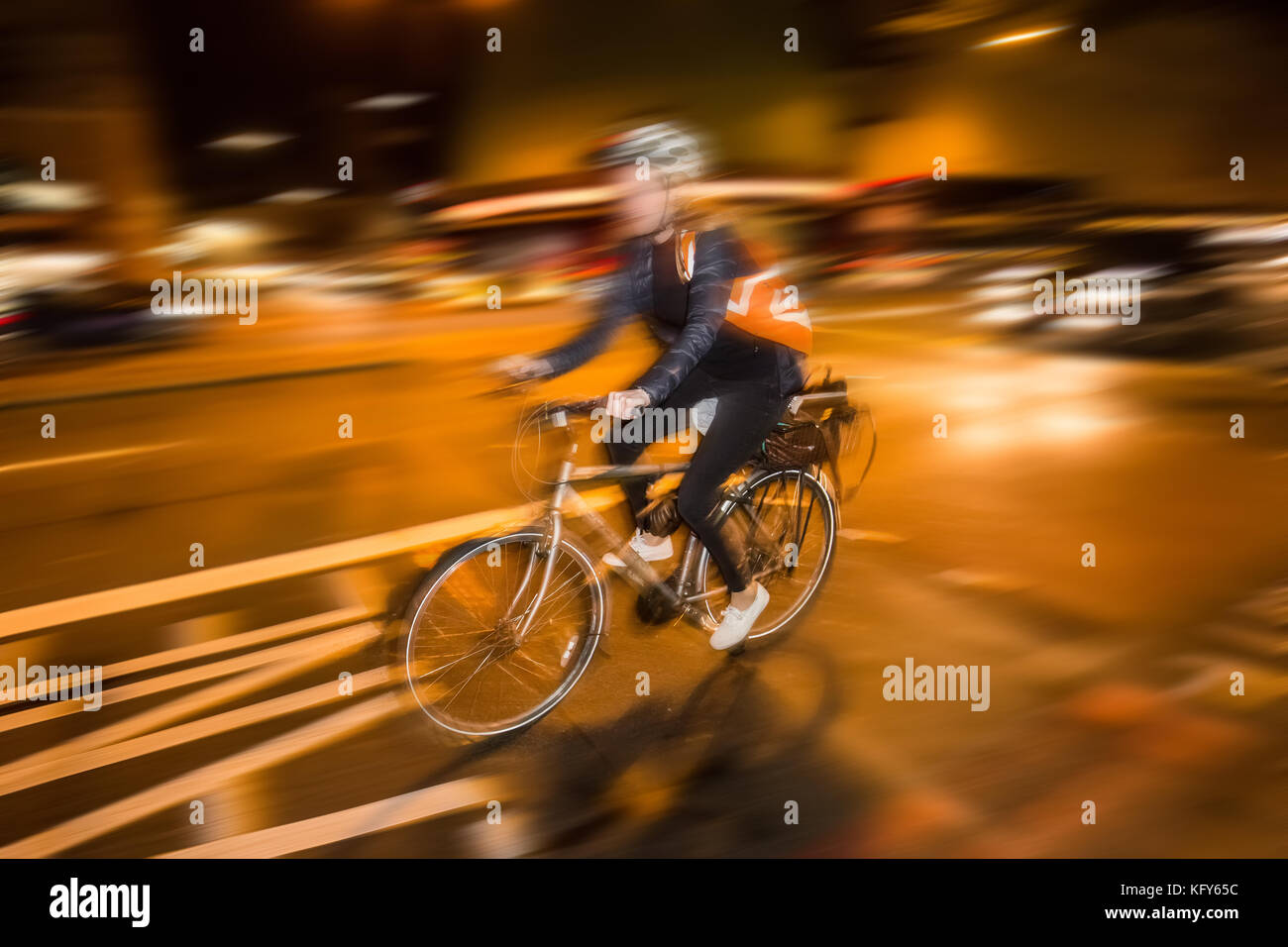 A city cyclist during evening rush hour passes through Baker Street ...